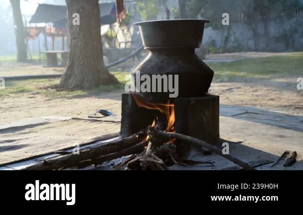 Traditional clay stove with wood fuel, Rural kitchen. Traditional ...