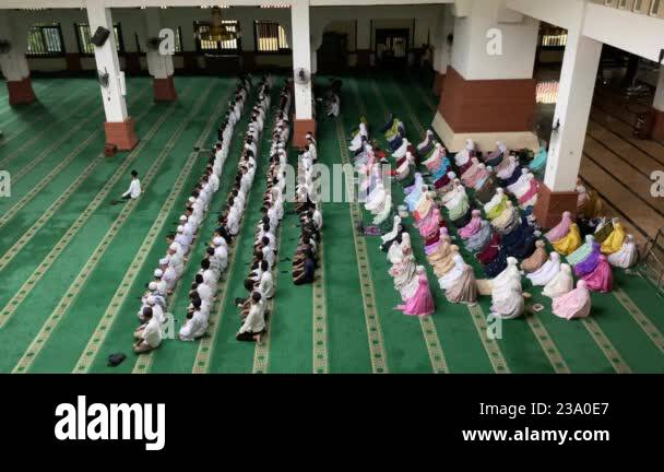 Semarang, Indonesia - February 17th 2024: Women Islamic people praying inside mosque, sitting ...