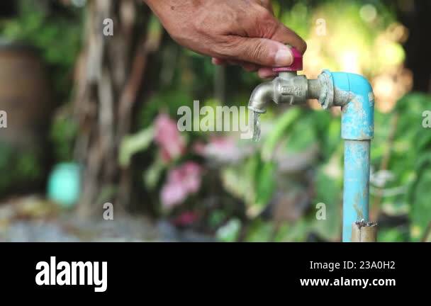 faucet in garden, water tap with hand open and closes, water valve ...