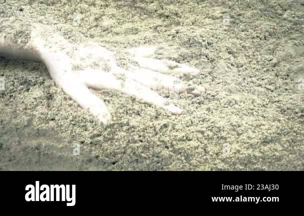 Police Photograph Hand Buried In Sand Stock Video Footage - Alamy