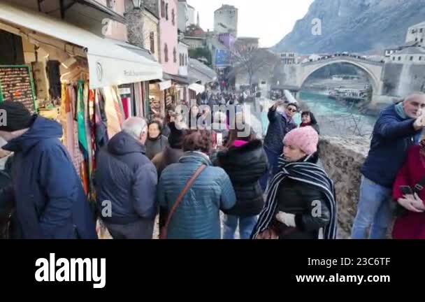 Mostar, Bosnia - 1 JAN 2025: Tourists explore the lively streets of ...