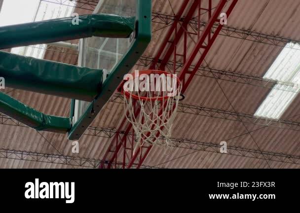 close-up shots of basketballs shooting towards basketball hoops in ...