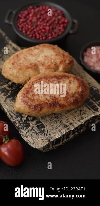 Delicious fresh fried minced fish cutlets with spices and herbs on a ...