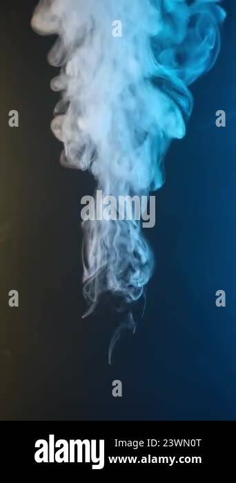 Vertical video. Curls of smoke move on a colorful background. Abstract ...