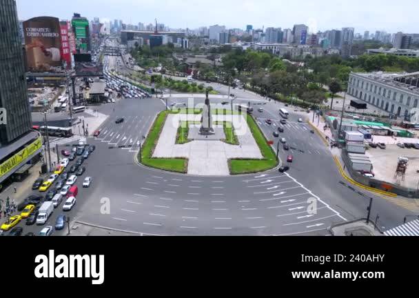 Drone perspective of a busy urban plaza crowded with pedestrians and ...