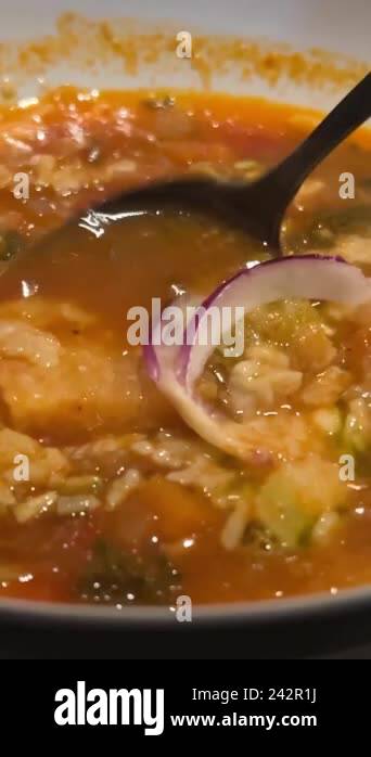 food video mole de panza menudo or mondongo close up. vegetable tomato ...