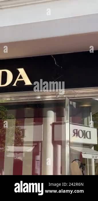 Prada logo sign and text brand on store facade entrance shop Croisette ...