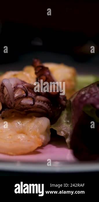 Fresh octopus salad with potatoes, olives and parsley. Healthy food ...