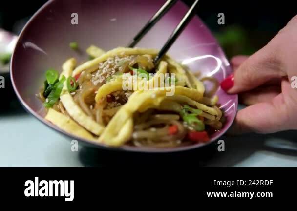 hand pick up steamy instant noodle /hot ramen with chopsticks with ...