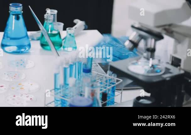 laboratory microscope with test tubes Stock Video Footage - Alamy