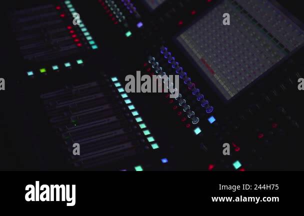 Professional audio mixing console featuring multiple digital screens ...