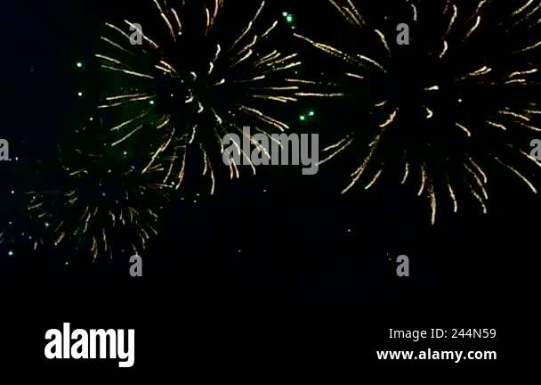 4K. loop seamless of real fireworks background golden shining fireworks ...