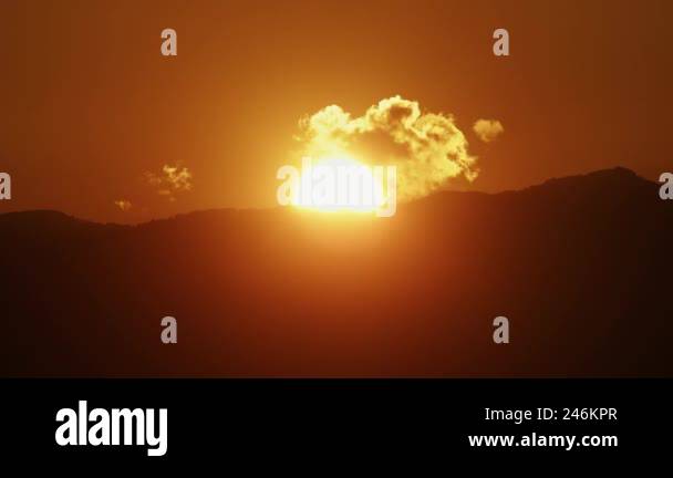 Orange Sun Falling Down A Mountain Stock Video Footage - Alamy