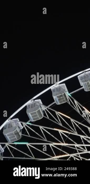 Ferris wheel rotating at an amusement park at night. Great for projects ...