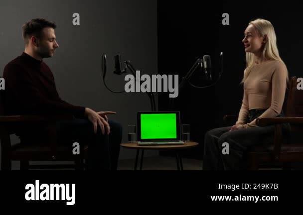 Online podcast show. Man host and woman guest recording interview in ...