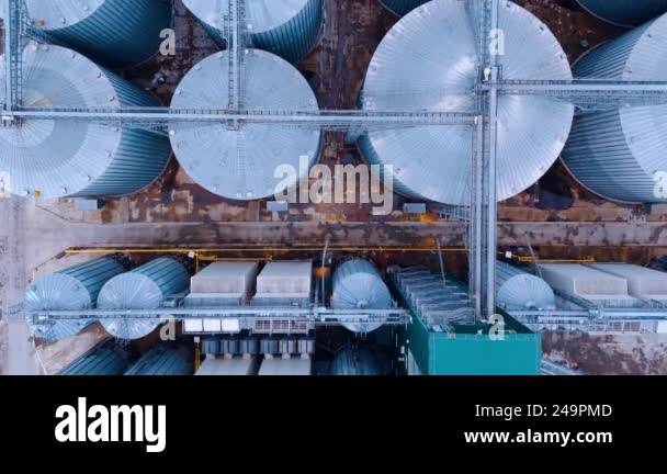 Large metal tanks of diverse diameter in several rows. Drone footage ...