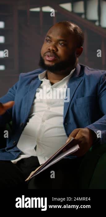 Vertical Video Two espionage agents reviewing confidential documents in ...