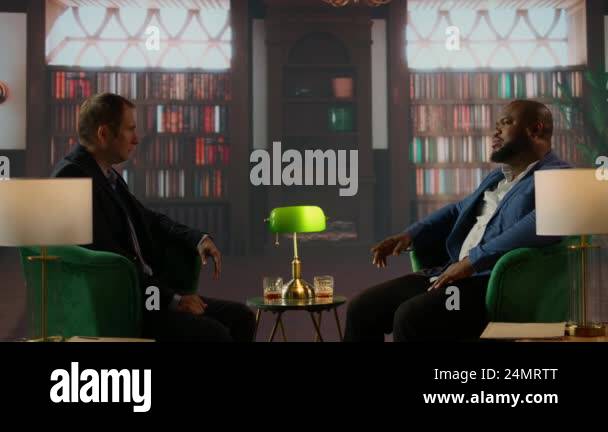 Confident old money heirs engaged in strategic conversation at the ...