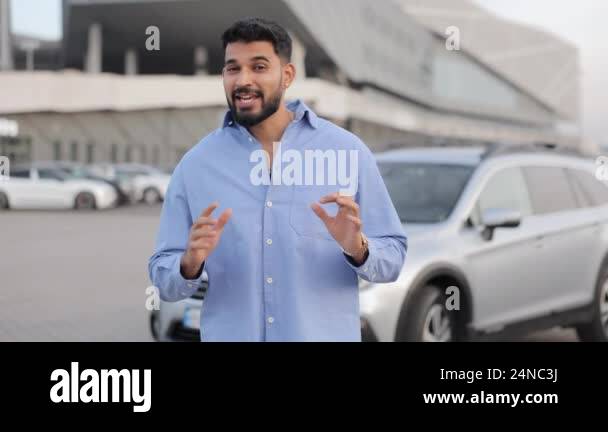 Handsome Caucasian journalist, news reporter broadcasting on street ...