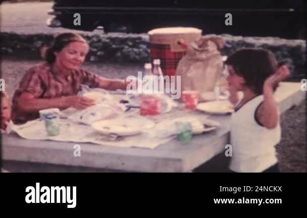 family stops at a roadside picnic table for lunch near Atlanta Georgia ...
