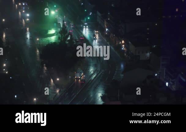 Night View from Kyoto with Bus and Cars on the Rainy Road, Reflections on the Wet Pavement. High ...