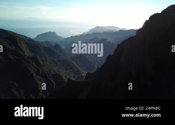 Aerial drone footage over mountains in Madeira Island, Portugal. Pico ...