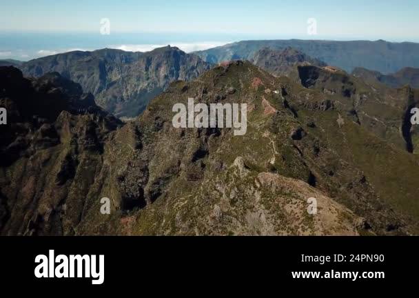 Aerial drone footage over mountains in Madeira Island, Portugal. Pico ...