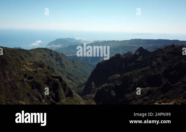 Aerial drone footage over mountains in Madeira Island, Portugal. Pico ...