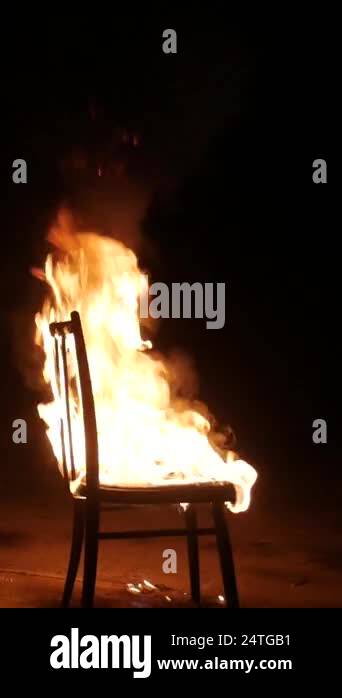Vertical, The chair is on fire. Big mystical fire at night. A large ...