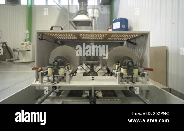 Large rotating rollers create rope shape of cardboard surface ...