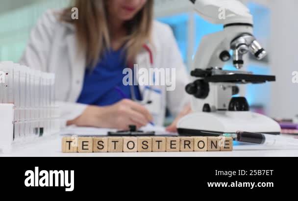 Word Testosterone against medical research scientist examining test ...