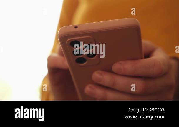 Woman hand holding cell phone touch screen typing scroll page using app. Smartphone mobile phone ...