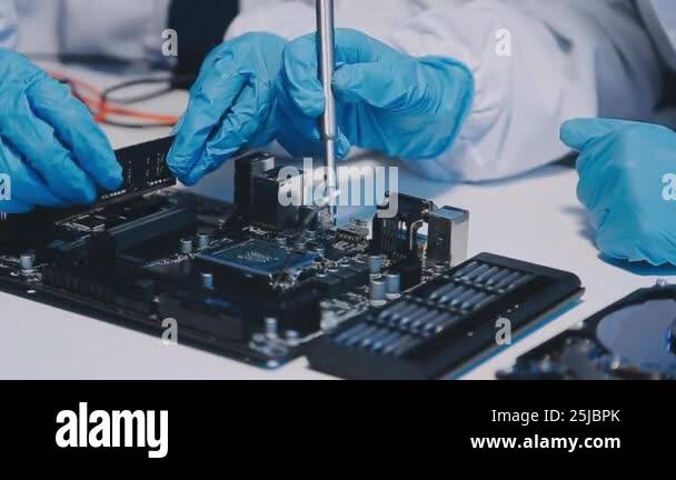 technician repairing a computer motherboard Stock Video Footage - Alamy