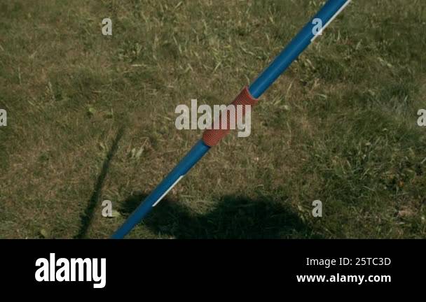 Closeup of hand and shadow of anonymous male athlete with tattoo on arm ...