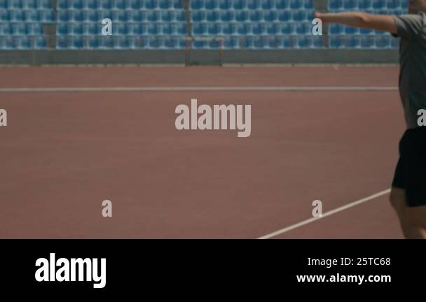 Medium shot of young Caucasian male athlete with disability running to ...