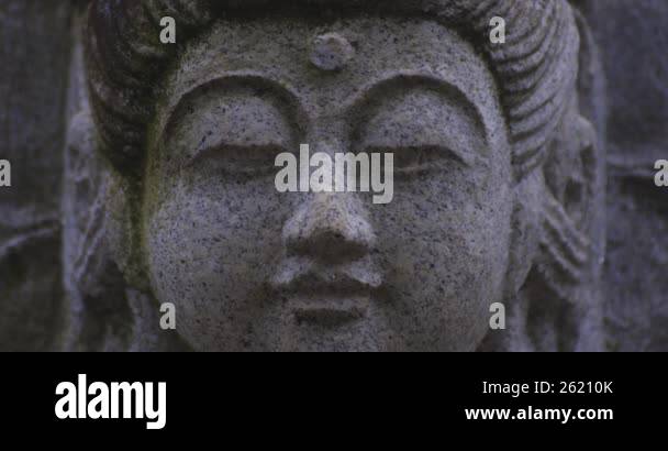 A buddhism stone statue at Japanese temple. High quality 4k footage ...