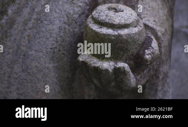 A buddhism stone statue at Japanese temple. High quality 4k footage ...
