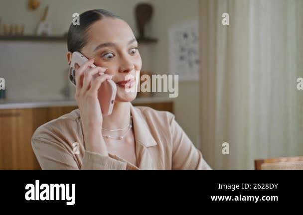 Joyful lady calling cellphone sitting modern kitchen closeup. Smiling ...