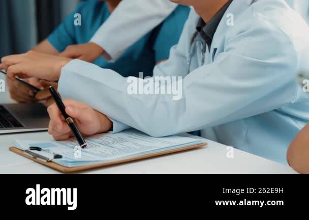 Professional group of medical working and planning medical treatment or ...