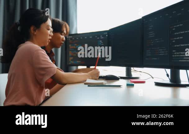 Slow motion back end software developer engineer for computer programming working together on ...