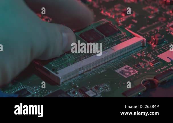 Milan, Italy 1 January 2025: Computer technician is installing a ram ...