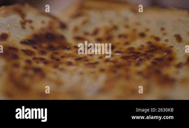 A close-up view of a baked pancake highlighting its structure and ...