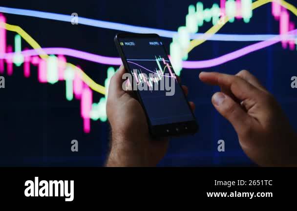 Trader or investor monitoring or looking stock market or crypto market ...