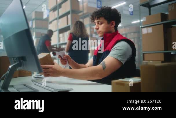 Slow motion of inventory manager scanning parcel with barcode scanner ...