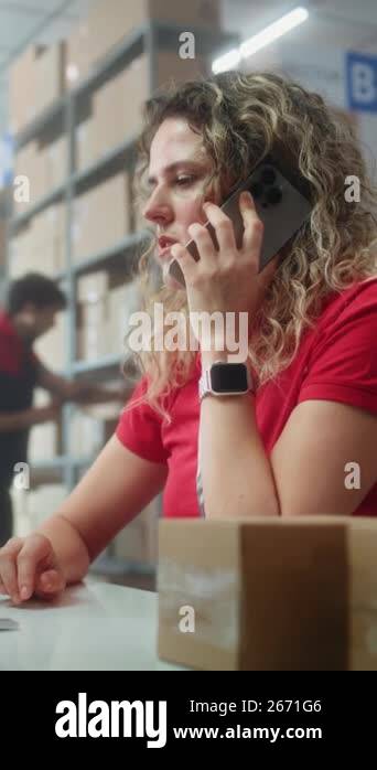 Female customer support specialist in logistics talks to customer on ...