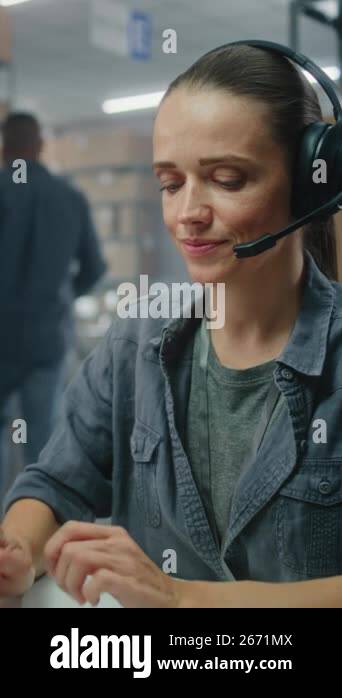 Warehouse of E-commerce online store: Female customer support specialist in logistics talks by ...