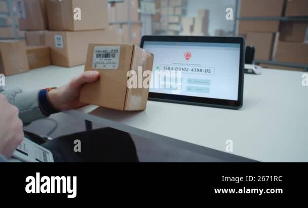 Postal Service Employee Scans Code on Cardboard Box with Barcode ...