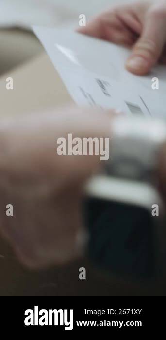 Close Up of Shipping and Receiving Clerk Putting Sticker with Track ...