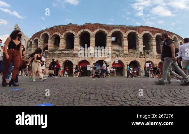 Verona, Italy 1 January 2025: Tourists wearing protective masks queuing ...
