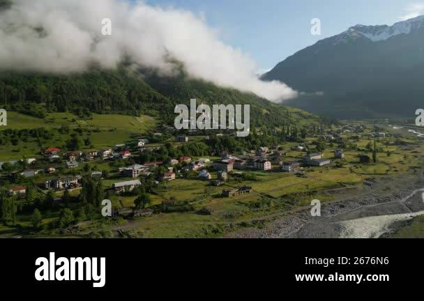 Aerial view of Svan towers in mountain valley at sunrise. Traditional ...